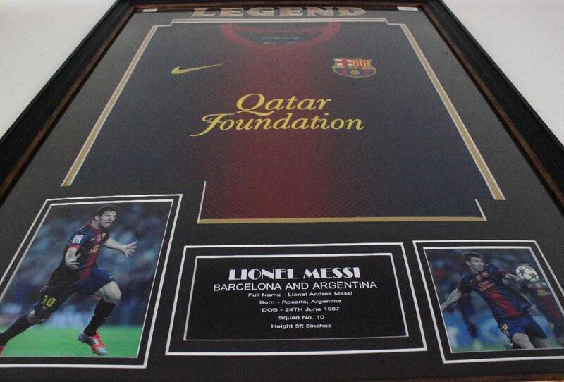 A signed and framed Lionel Messi Barcelona football shirt and two ...