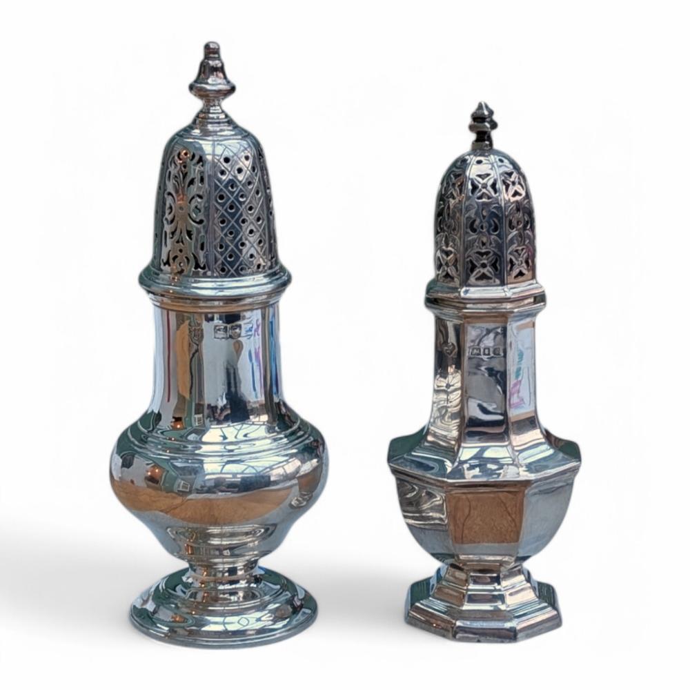 Two silver sugar casters, each with elaborately pierced and knopped ...