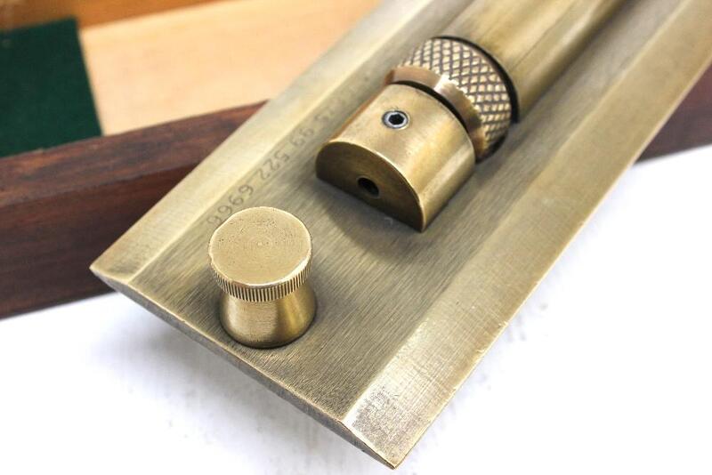 A 20th century military issue brass map plotters tool, cased, bearing ...