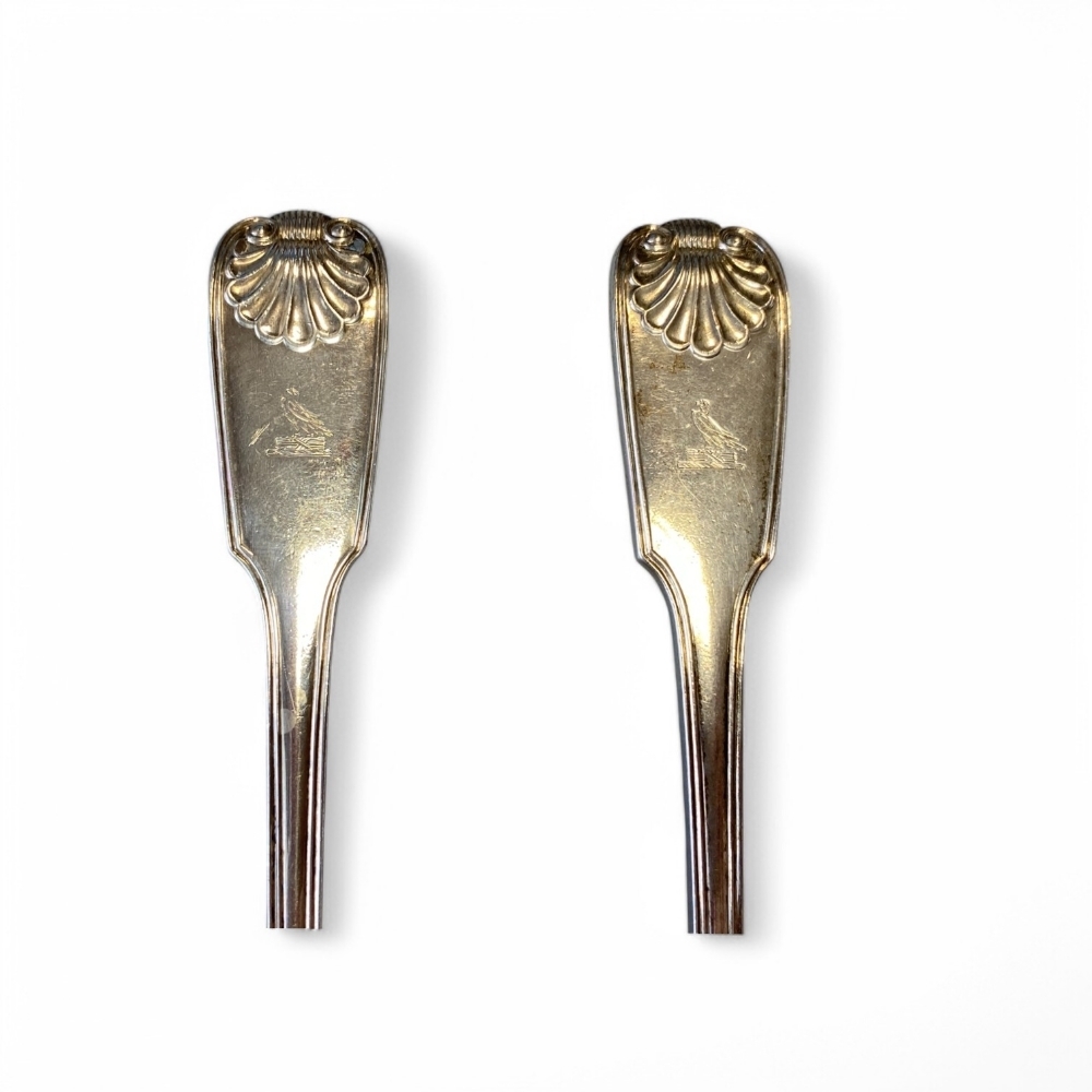 A pair of Victorian fiddle pattern silver serving spoons with shell ...