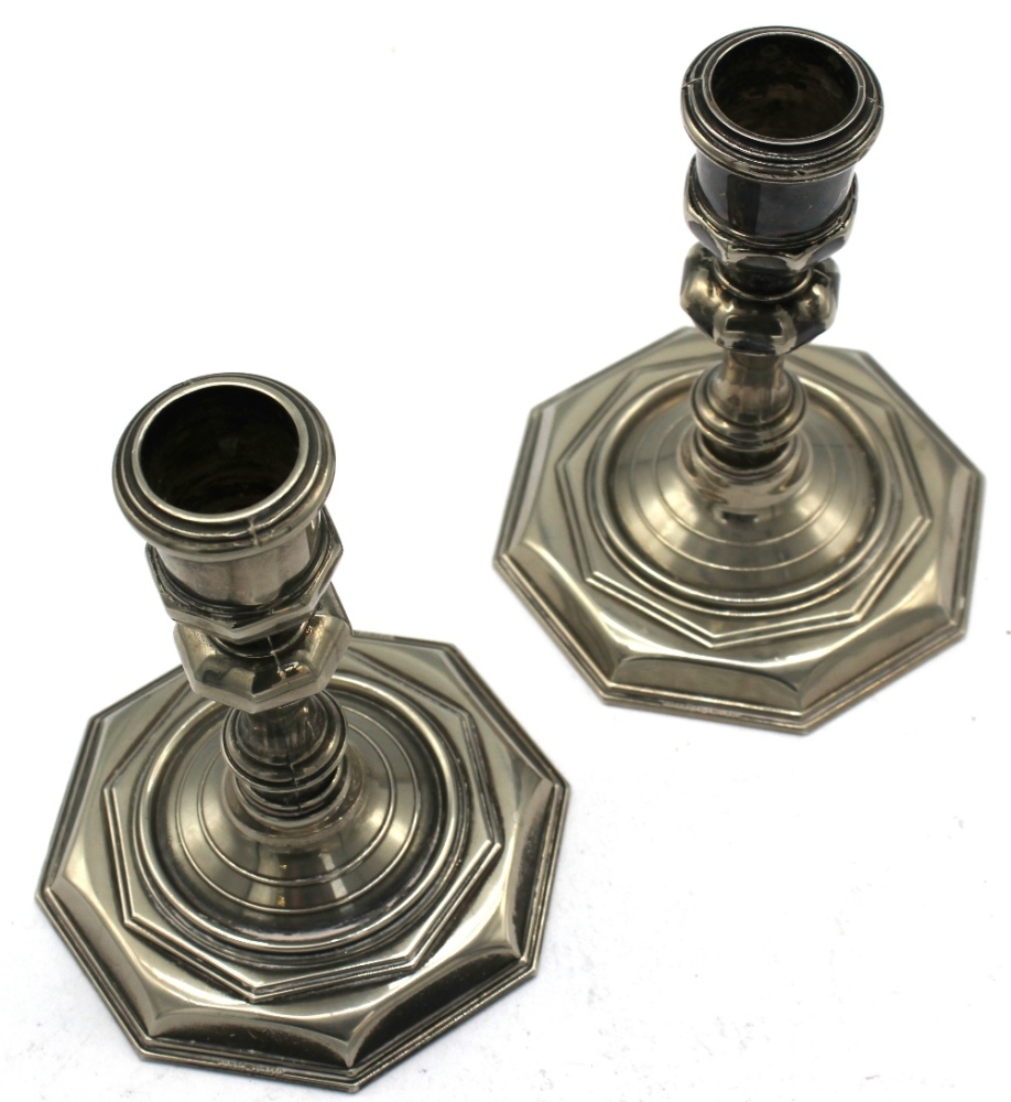 A pair of 20th century silver plated candlesticks, having octagonal ...