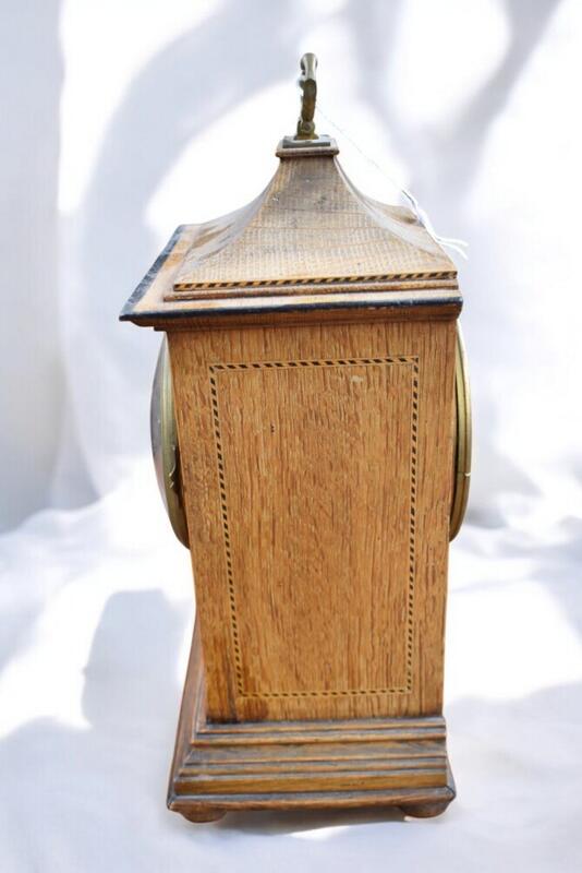 An Edwardian oak mantle clock, with body of rectangular shape with ...