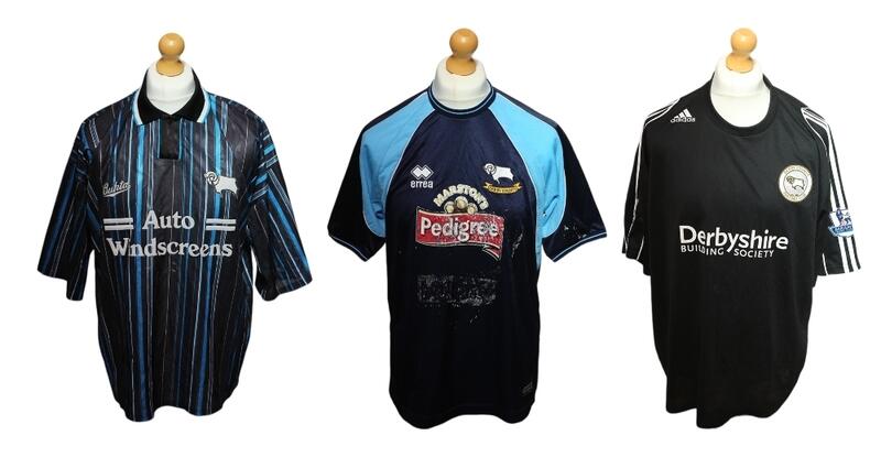 Three retro Derby County FC football shirts.