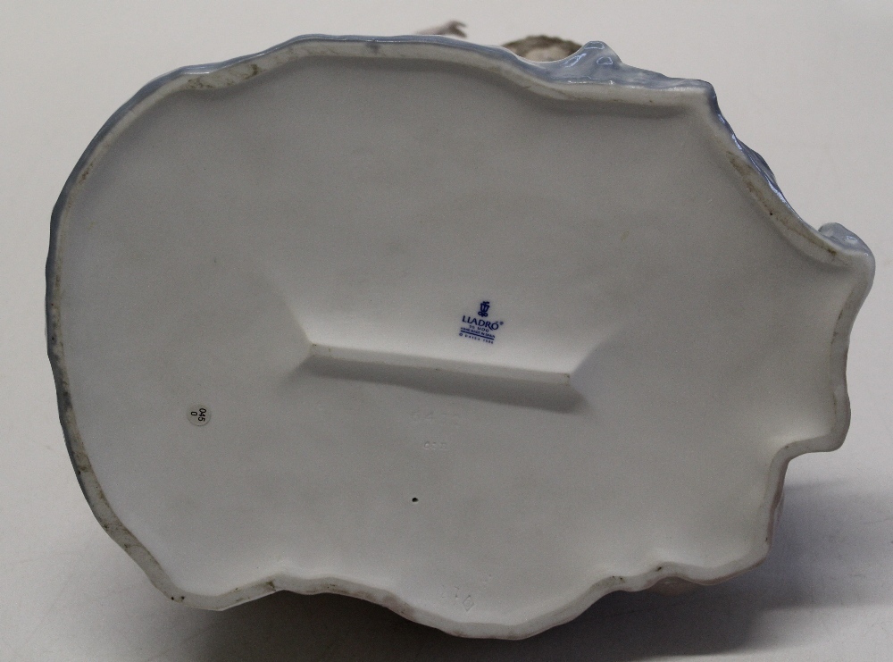 A large and scarce Lladro porcelain figure group. Modelled as a young ...