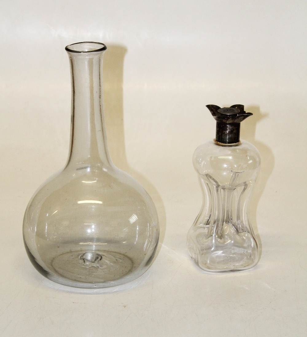 Two decanters. One Glug - Glug decanter, early 20th century together ...