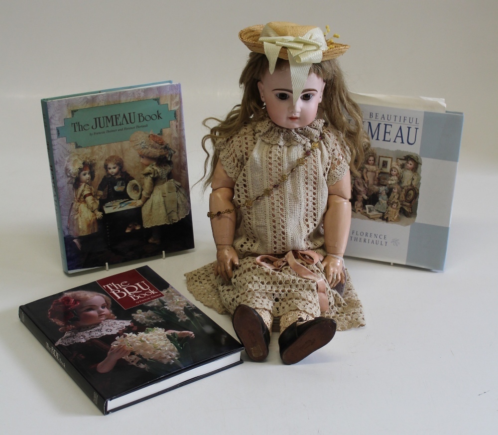 An early 20th century 24'' Jumeau bisque head doll. Red printed ...
