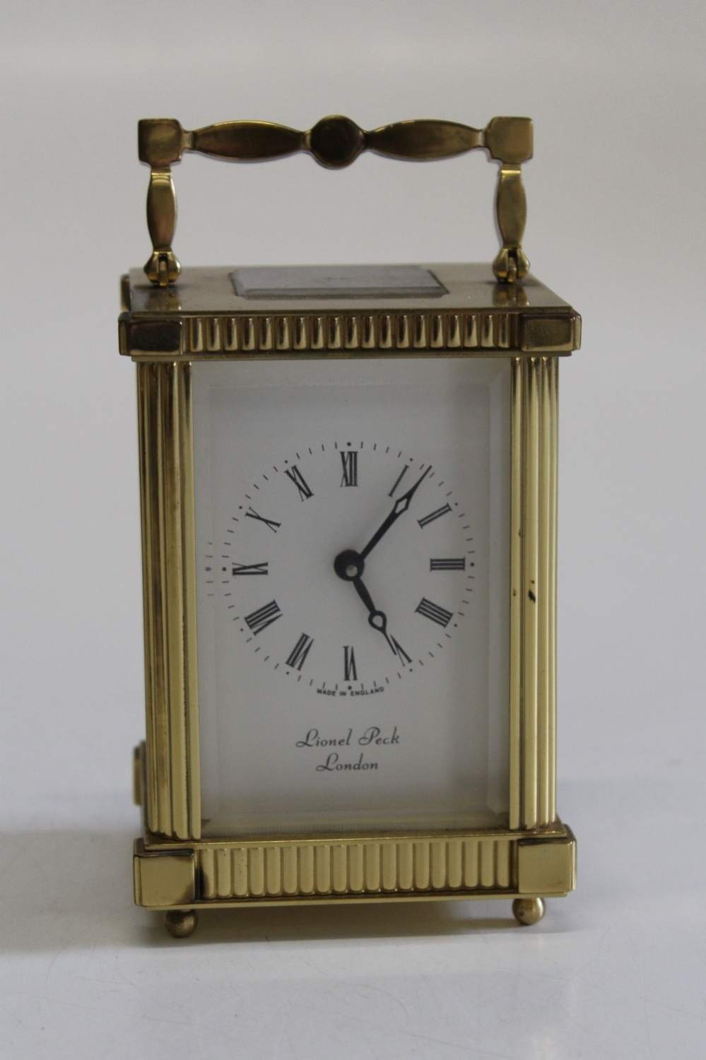 A Queen Elizabeth II five glass carriage timepiece, the Roman dial ...