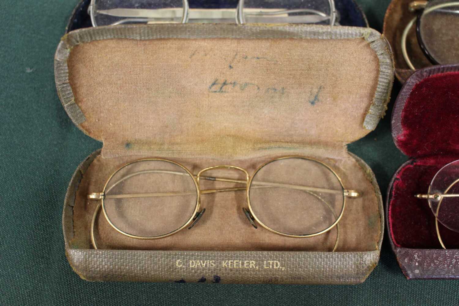 Various early 20th spectacles one with 9ct gold frame, cased