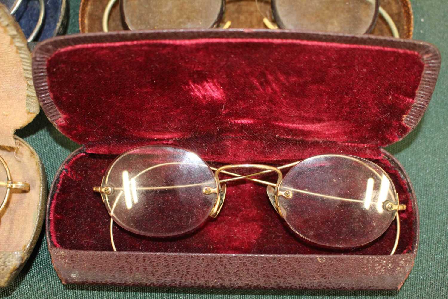 Various early 20th spectacles one with 9ct gold frame, cased