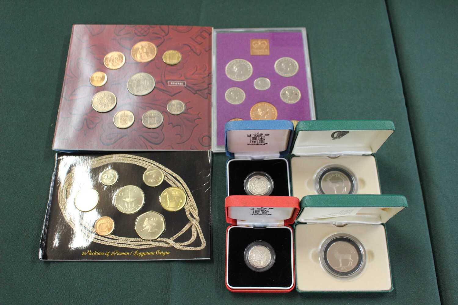 A collection of UK & Ireland cased uncirculated proof coin sets in ...