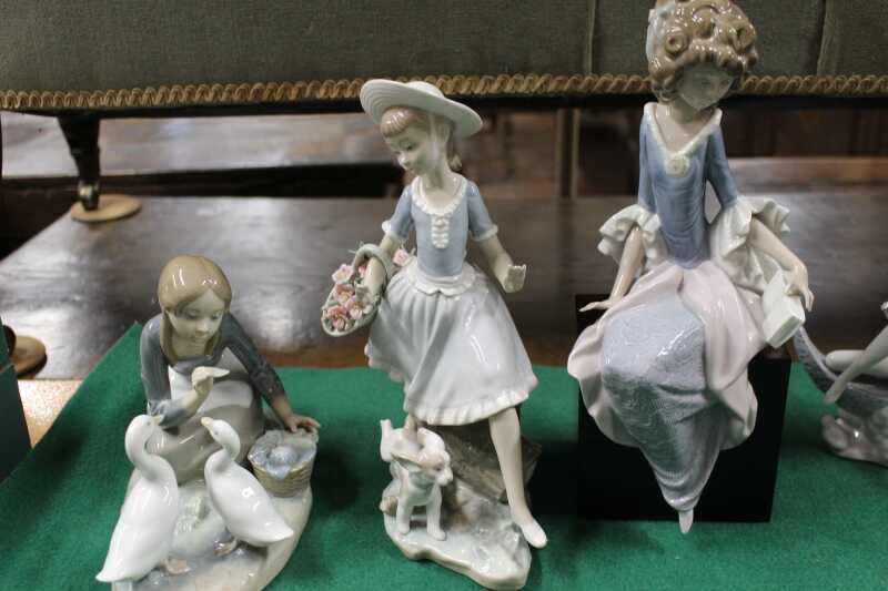 Fourteen Lladro figures to include Moon Glow , 18cm high, Mother and ...