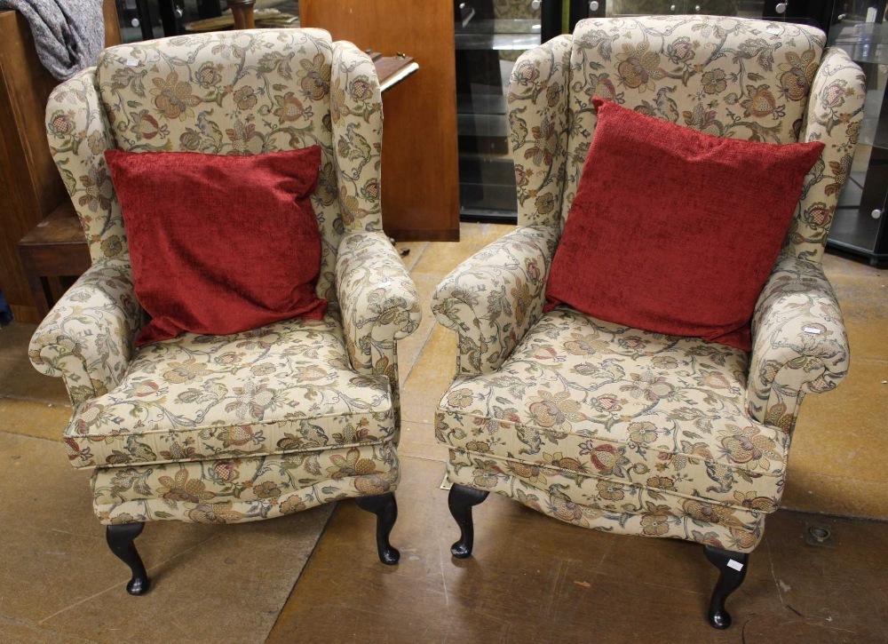 2 x wingback upholstered fireside arm chairs. raised legs. may need a ...