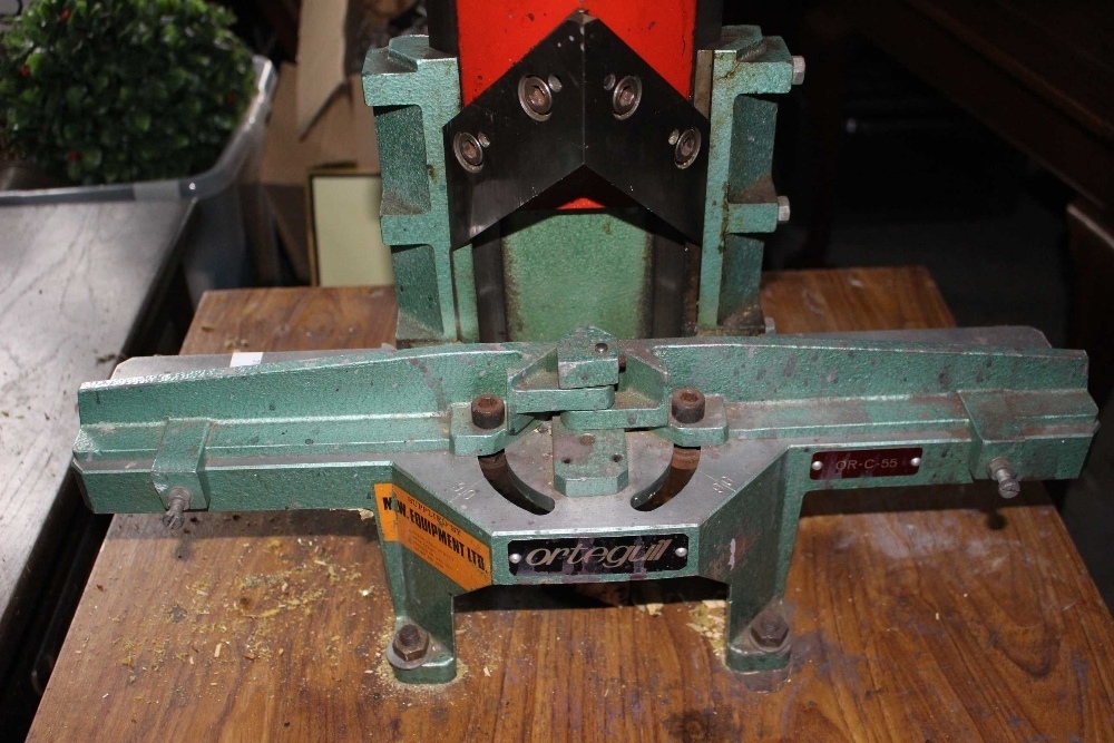 Table mounted MItre cutting machine for picture framing.