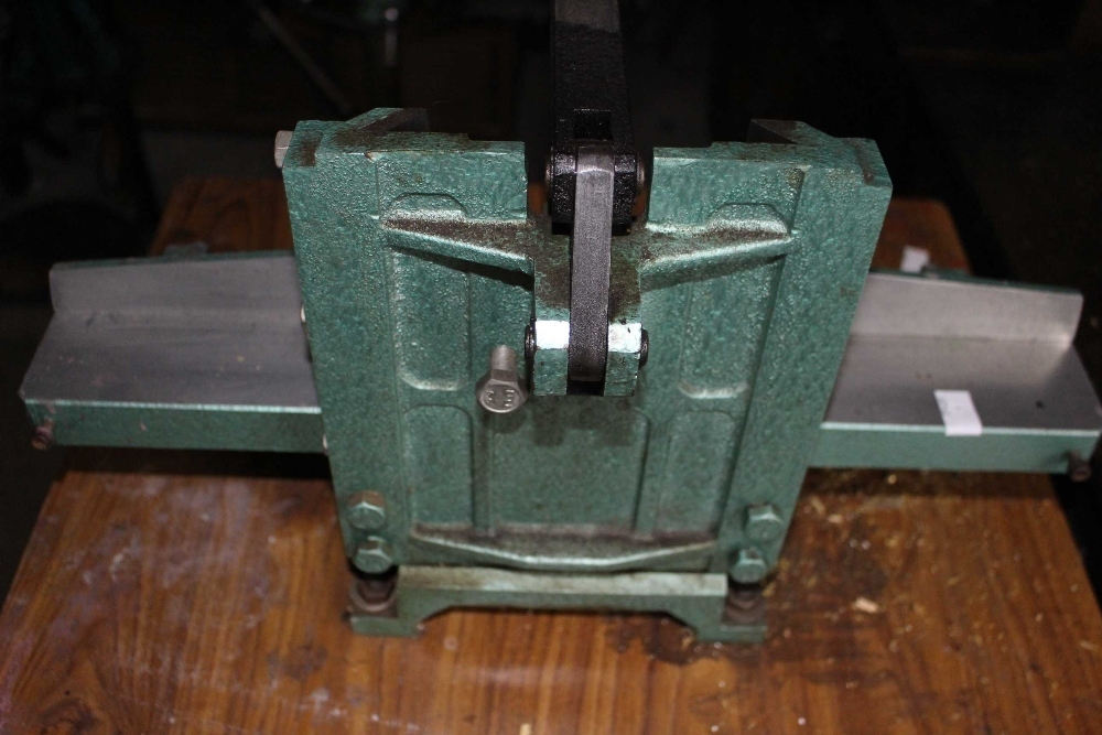 Table mounted MItre cutting machine for picture framing.