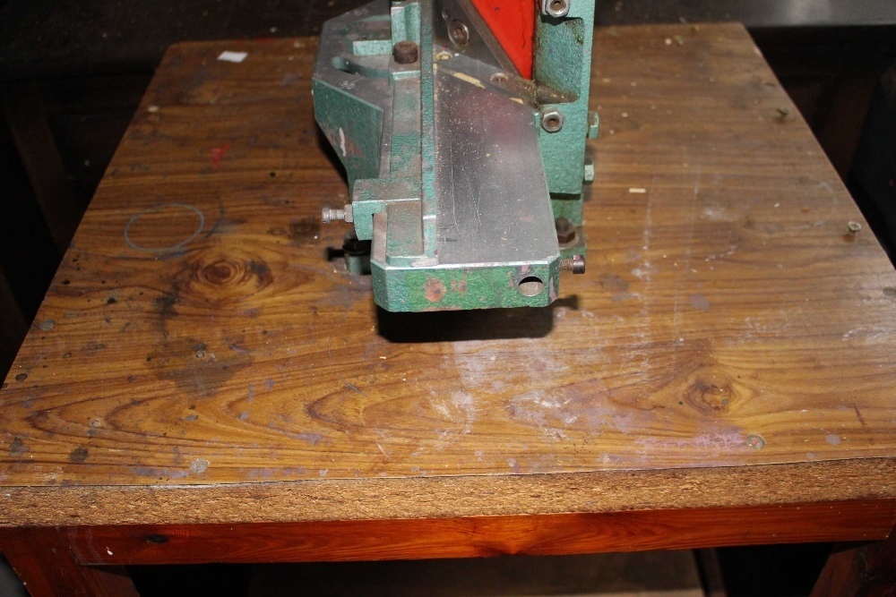Table mounted MItre cutting machine for picture framing.