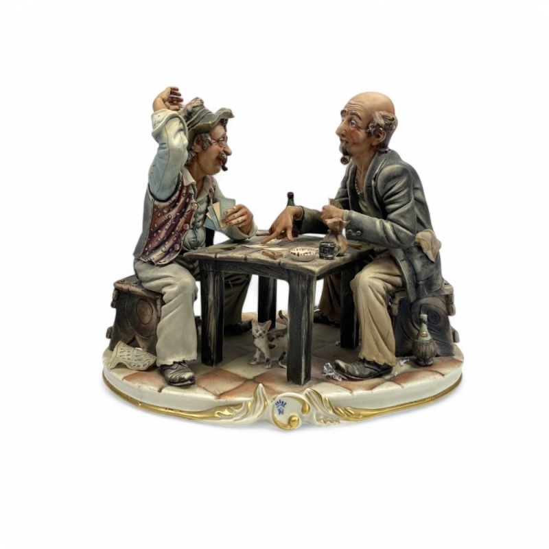 Two Capodimonte figures, a figure group of two elderly men playing ...
