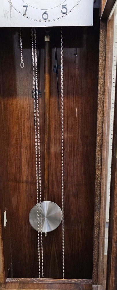 A French Art Deco longcase clock having three train striking movement ...