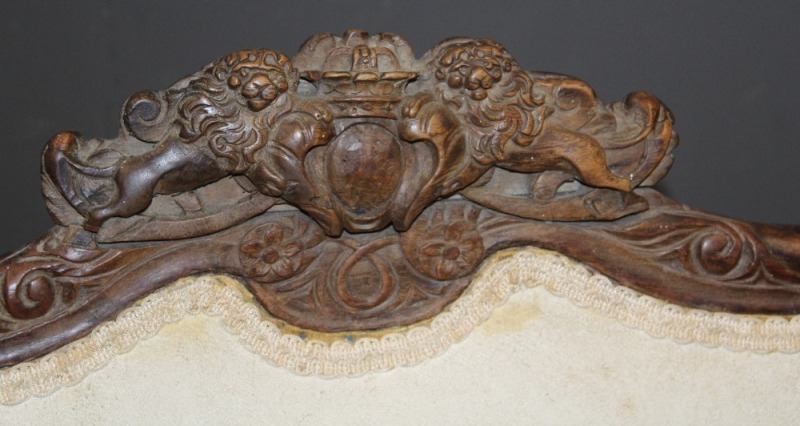 An 18th century carved walnut framed open elbow chair in the French ...