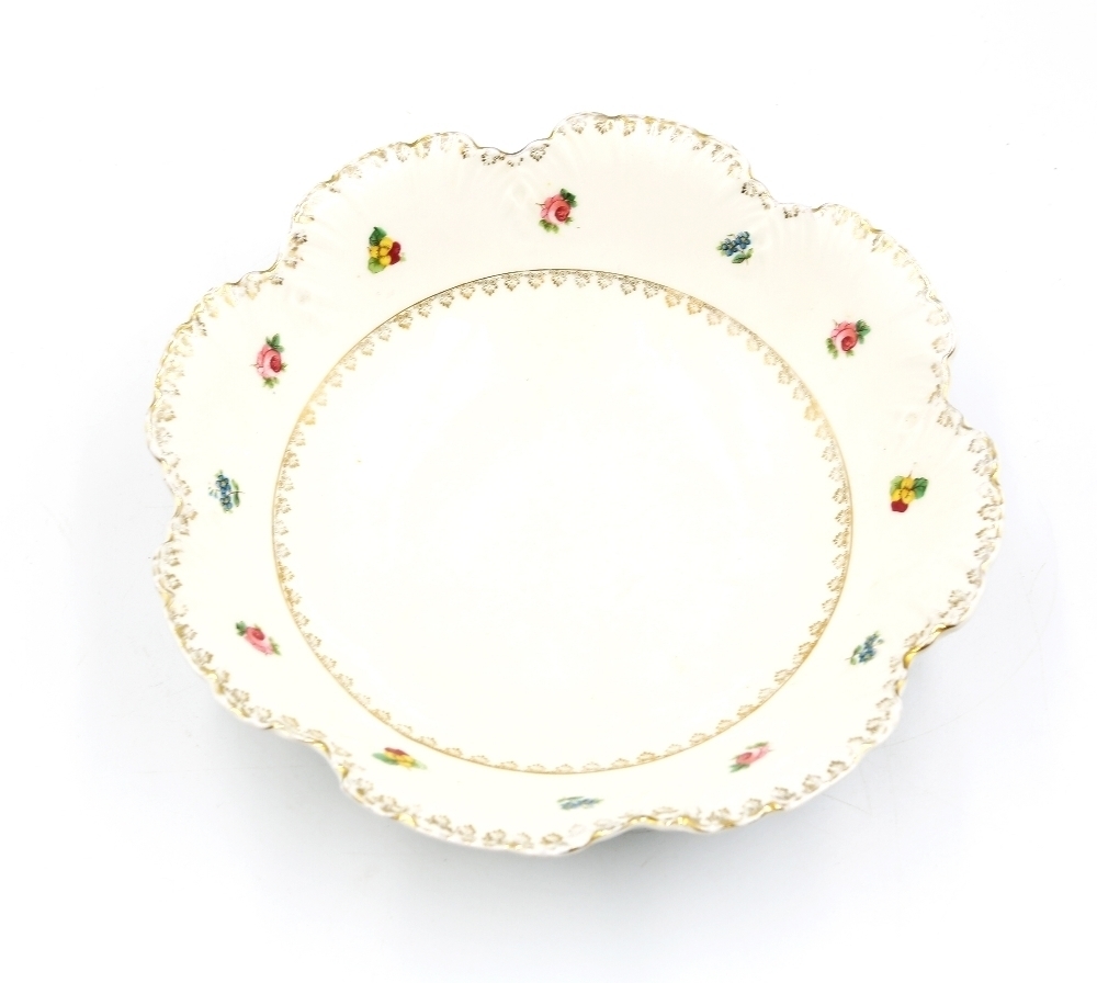 A Continental porcelain fruit bowl, with deep fluted rim and decorated ...