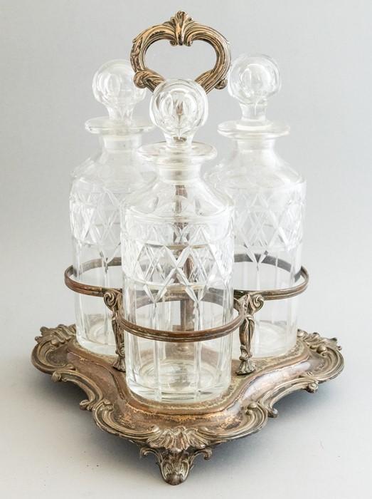 A 19th Century Sheffield plated trefoil decanter stand, of scroll ...
