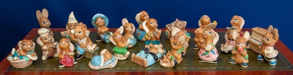 A collection of vintage Pendelfin rabbit figures.