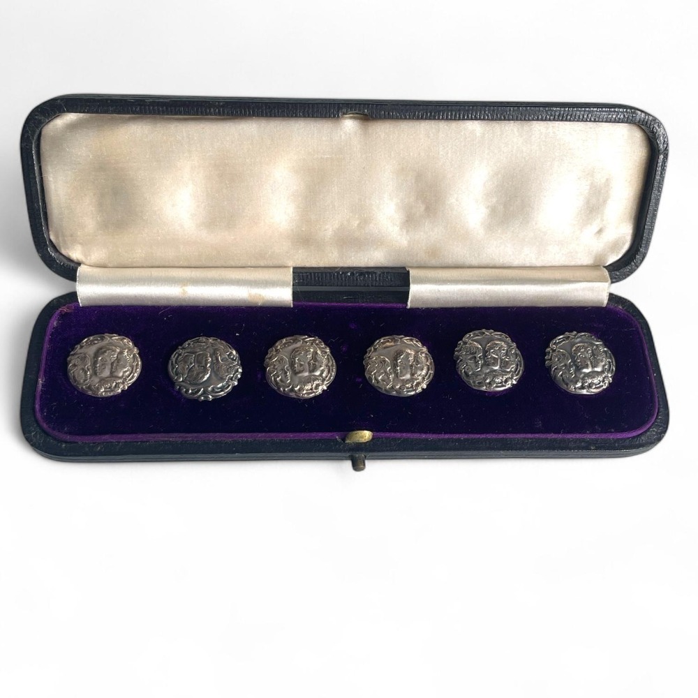 A set of six silver buttons, together 2with a contemporary silver dish ...