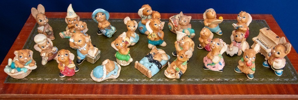 A collection of vintage Pendelfin rabbit figures.