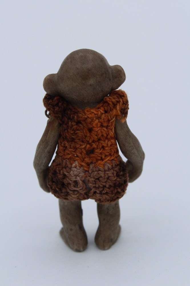 An early 20th century bisque Hertwig monkey doll in original crochet ...