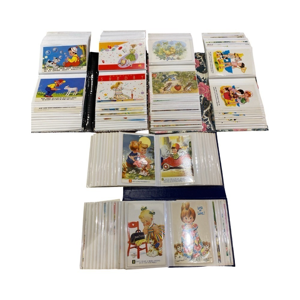 Three albums of children's comic and seaside humour postcards to ...