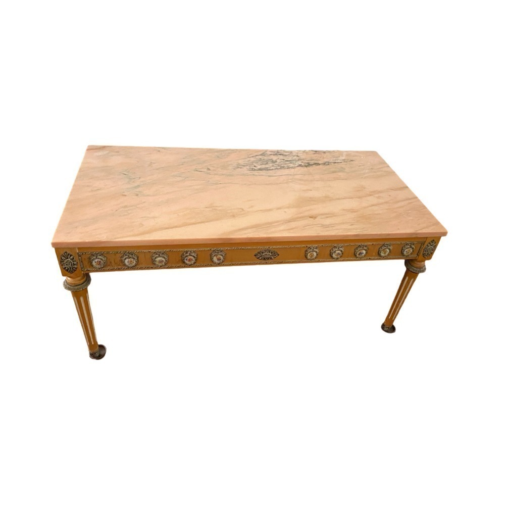 A pink marble topped occasional/coffee table. The borders decorated ...
