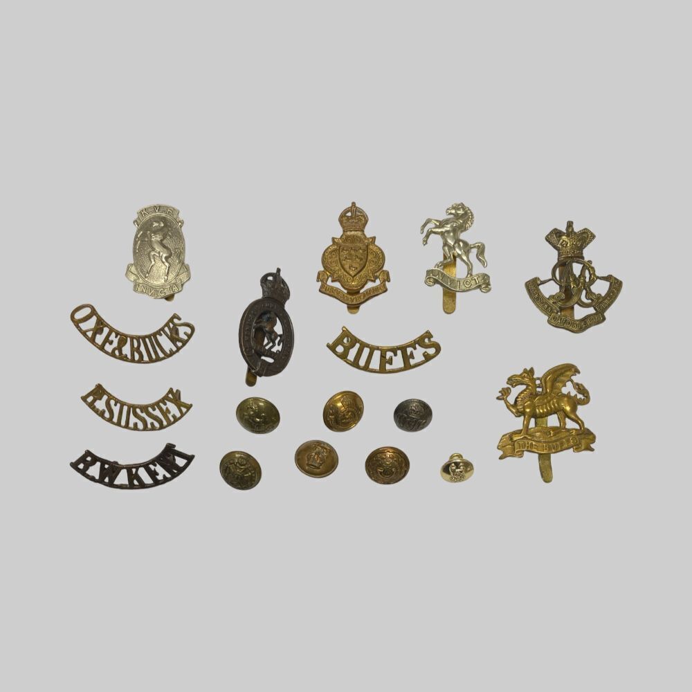Fifteen regimental badges, 5 shoulder titles and 7 buttons to include ...