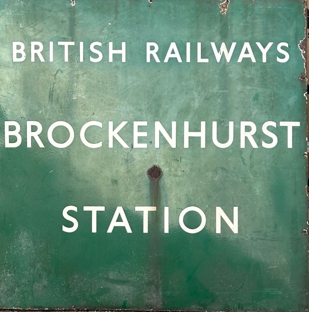 A large Green enamel Brokenhurst British Railway sign