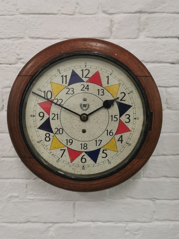 A 20th century beech framed circular wall clock, with applied RAF ...