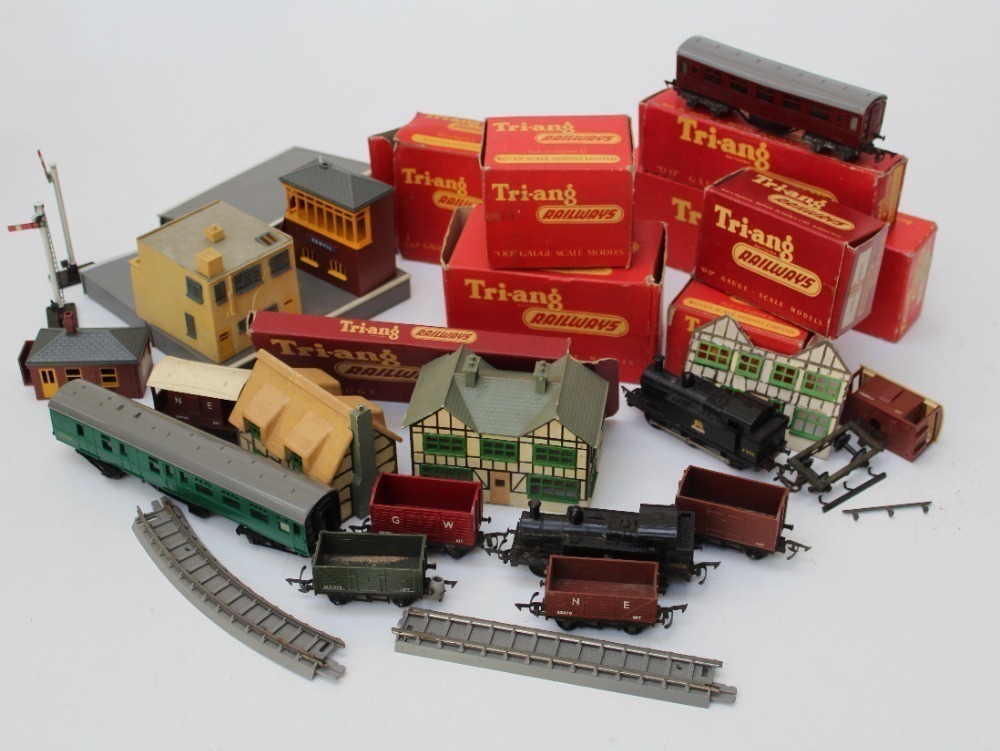 A collection of vintage Tri-ang railway items in leather suitcase