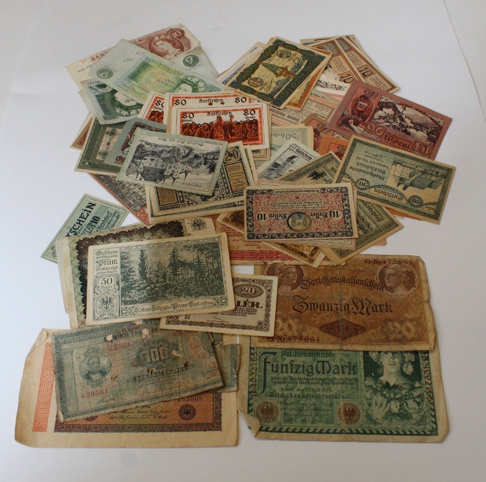 One bag of foreign bank notes plus English Ten Shilling and pound notes