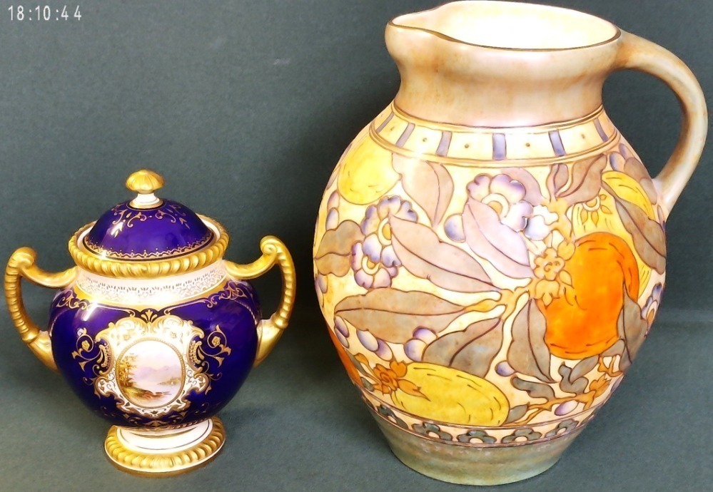A Coalport twin handled vase and cover painted with oval lakeland ...