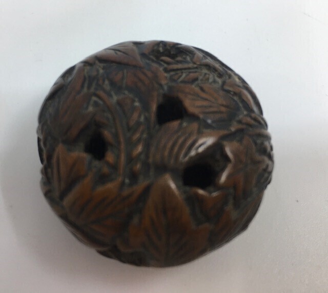 A Japanese Meiji period carved wooden Ryusa netsuke, diameter: 3.5cm