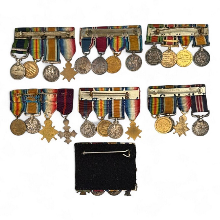 Seven WWI mounted miniature medal groups of four medals, unattributed ...
