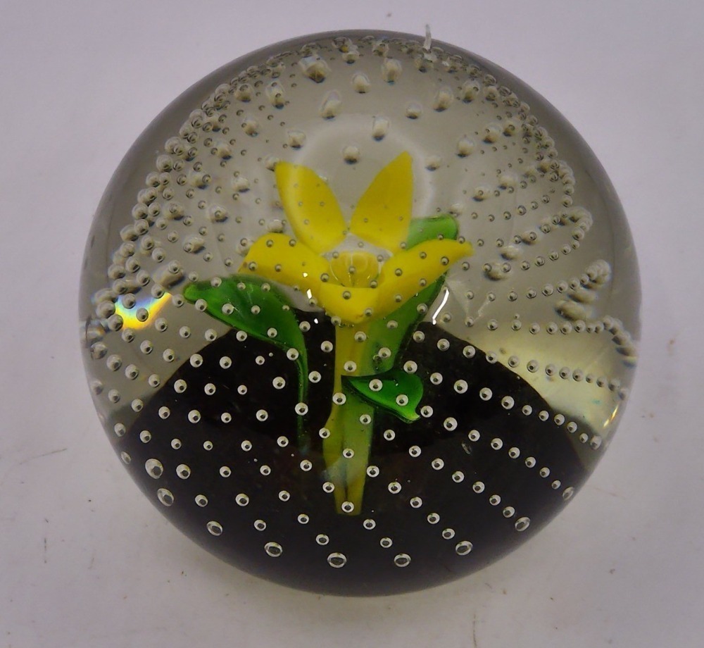 A Paul (Pablo) Ysart glass paperweight and one other Caithness flower ...