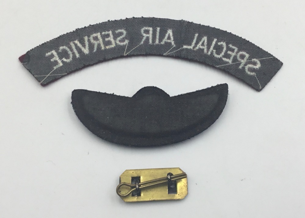 A selection of vintage SAS related badges, to include: a post WW2 ...