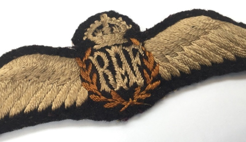 A WW2 era uniform removed RAF pilots wings badge. Of padded form, with ...