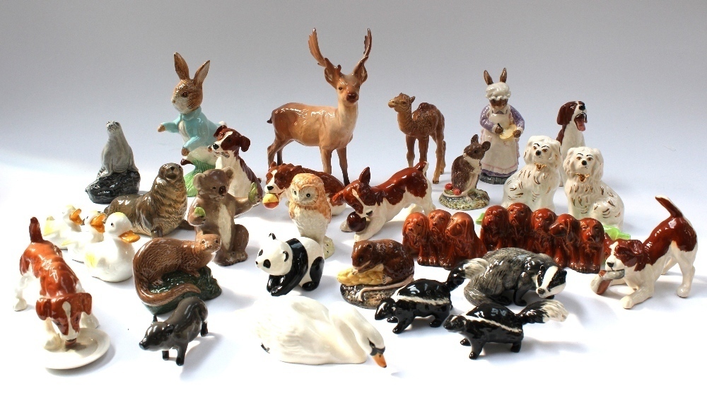 A collection of Beswick pieces to include a 5 Puppy Ashtray, a 3 puppy ...