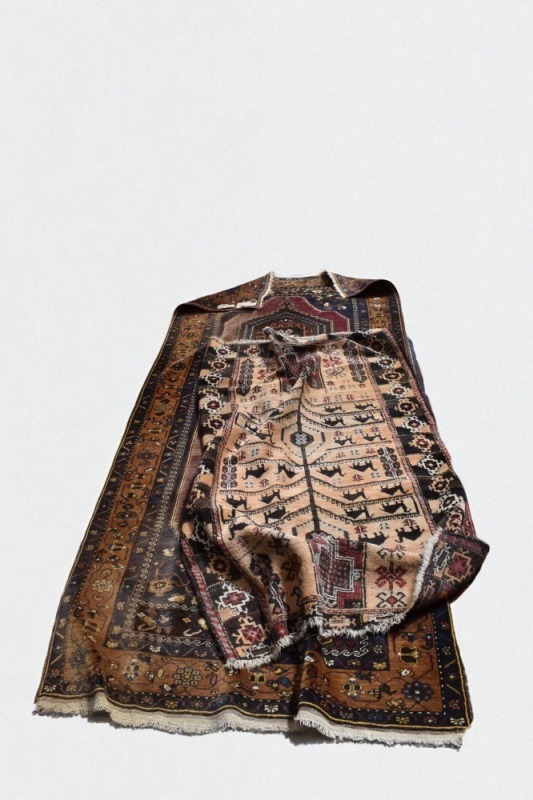 A Yahyali rug / runner in geometric mixed dark colours including red ...