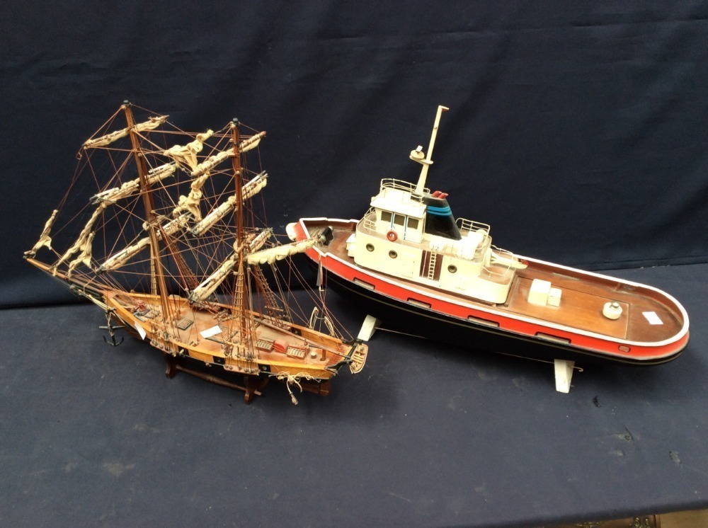 Two model boats on stands, both hand made, includes trawler and scooner.