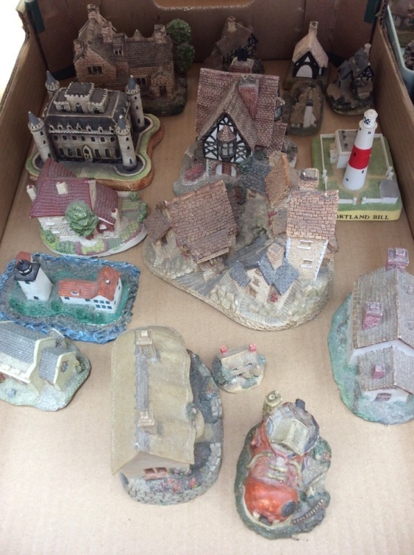 A collection of Lilliput lane cottages and buildings.