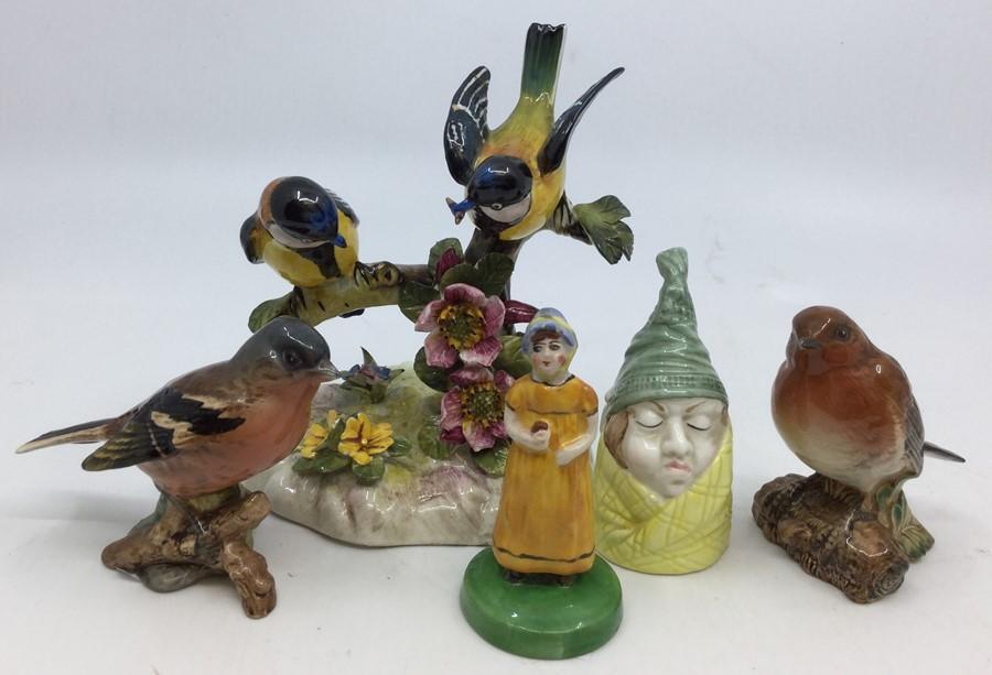 A group of ceramics to include: Beswick Robin 980 and Chaffinch 991 ...
