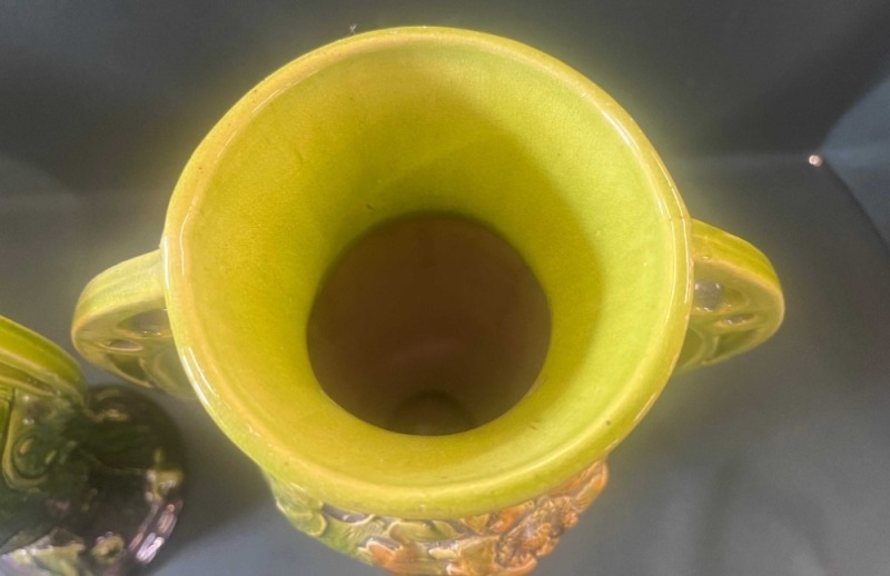 A pair of Bretby Art pottery green glazed twin handled vases moulded ...