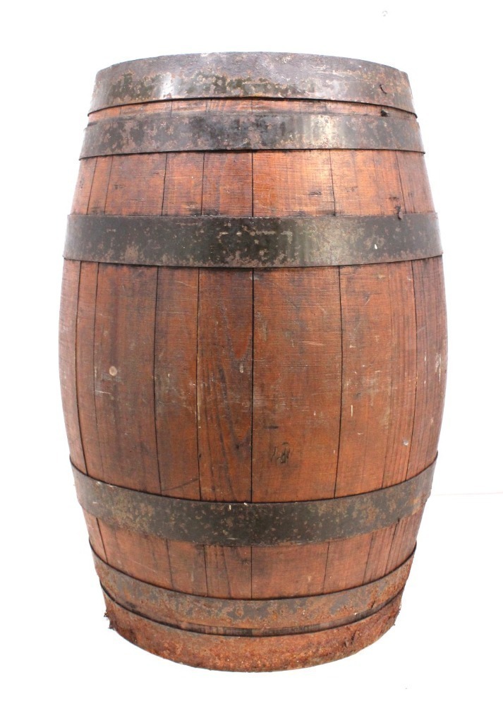 An oak vintage spirit cask barrel with cast iron banding.