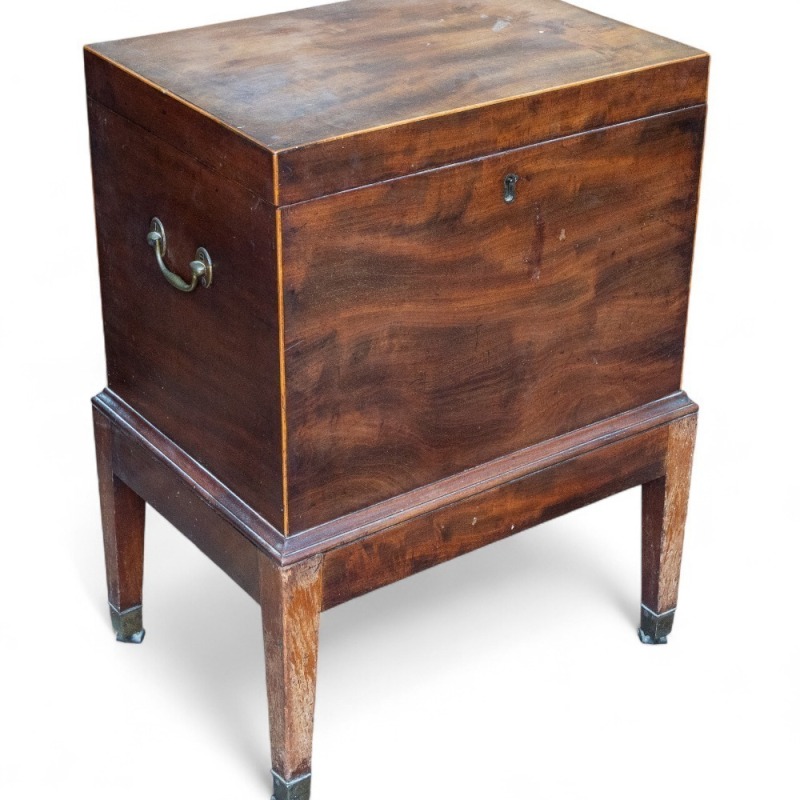 A George III mahogany box cellarette, featuring a hinged lid with the ...