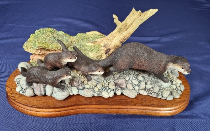 Four Border Fine Arts otter figures; complete with certificates